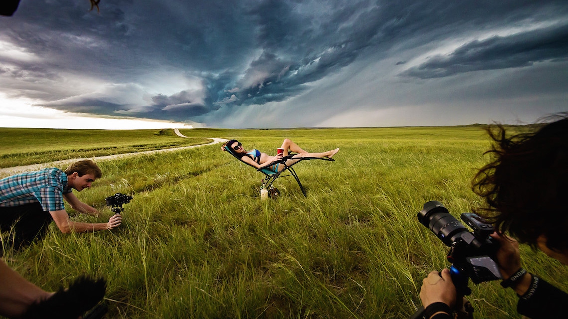 People pose in front of real storms in the Surreal Stormchasing series