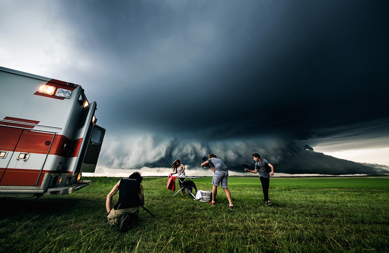 People pose in front of real storms in the Surreal Stormchasing series